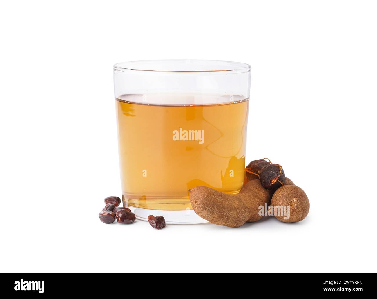 Glass of tasty tamarind drink and fruits on white background Stock ...