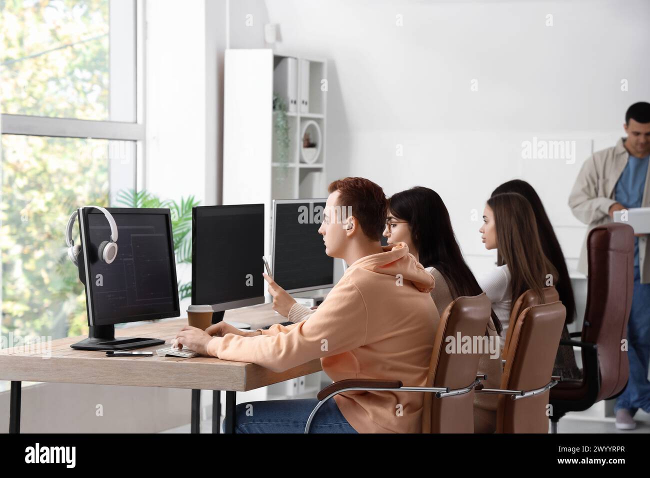 Team young programmers working hi-res stock photography and images - Alamy