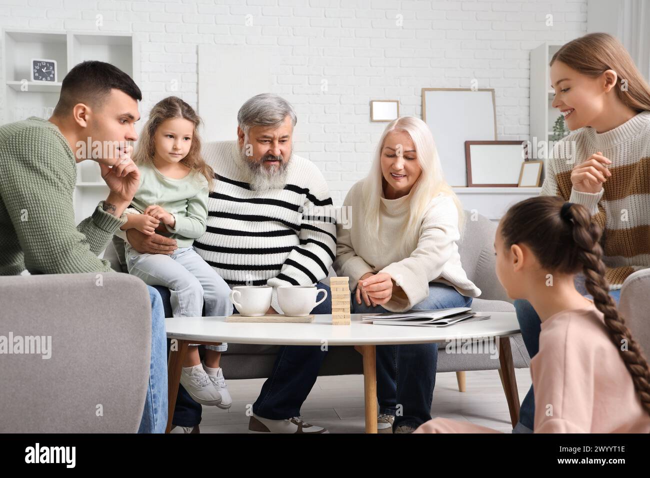 Big family playing game at home Stock Photo - Alamy