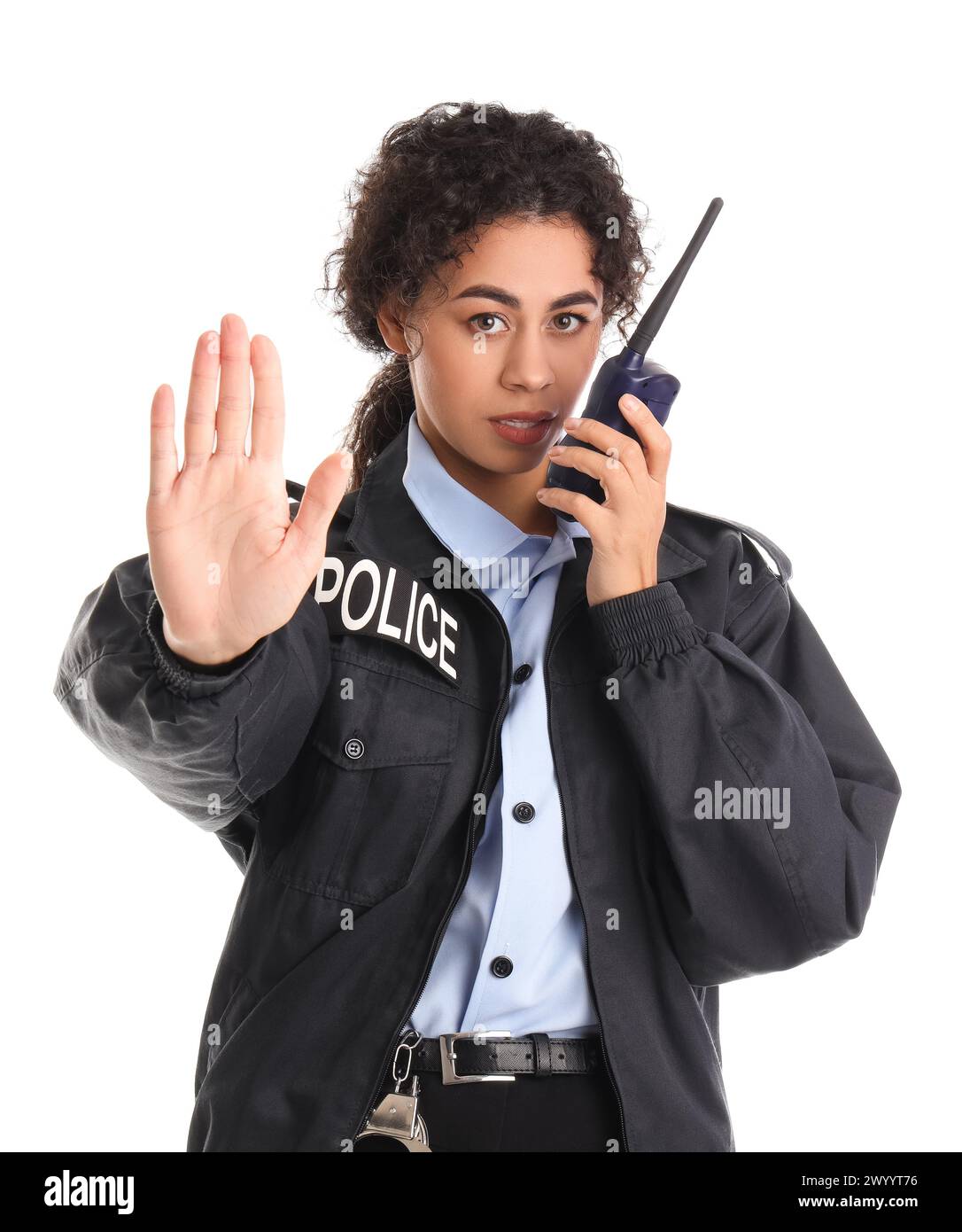 African-American female police officer with radio transmitter showing ...