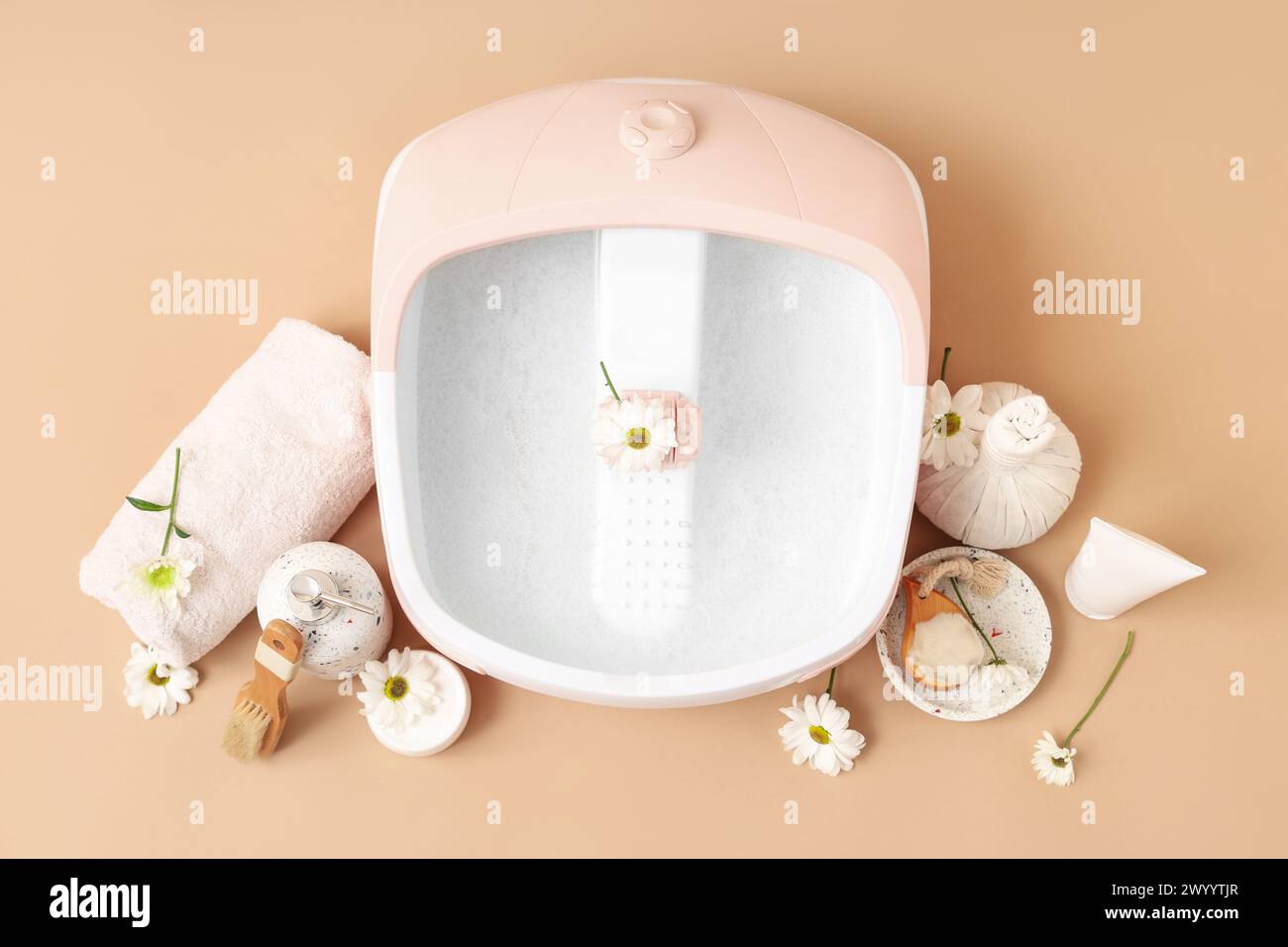 Set for foot massage on brown background Stock Photo - Alamy