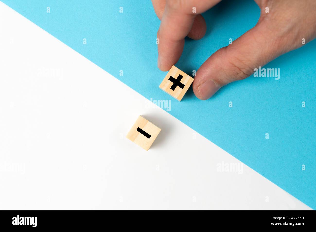 The concept of opposites or pros and cons using plus and minus signs ...