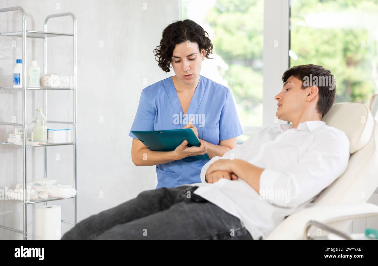 male patient documents signing Stock Photo - Alamy