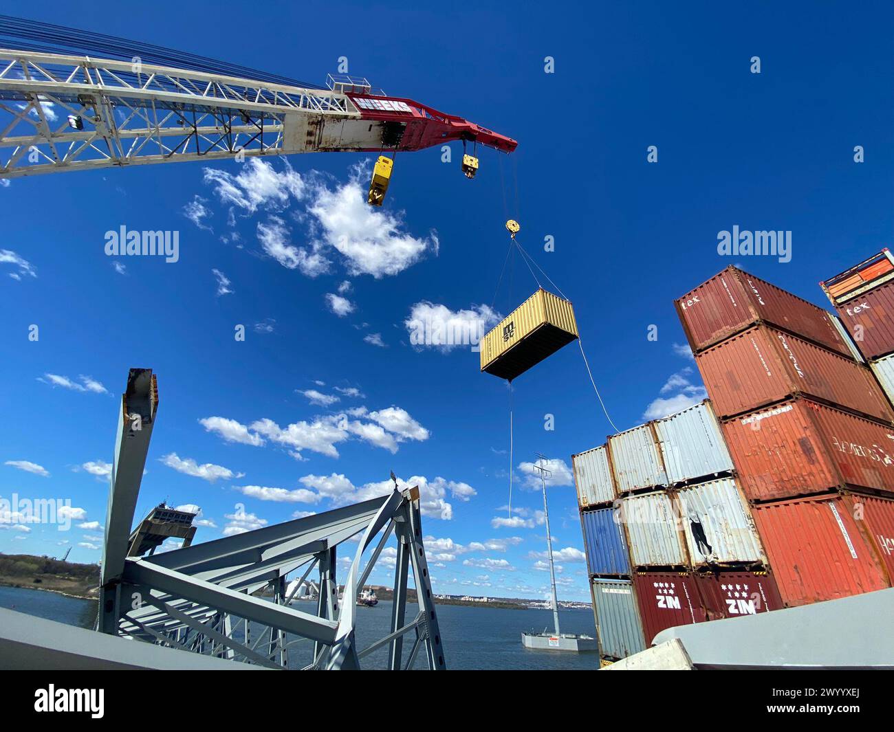 Response crews began removing shipping containers using a floating ...