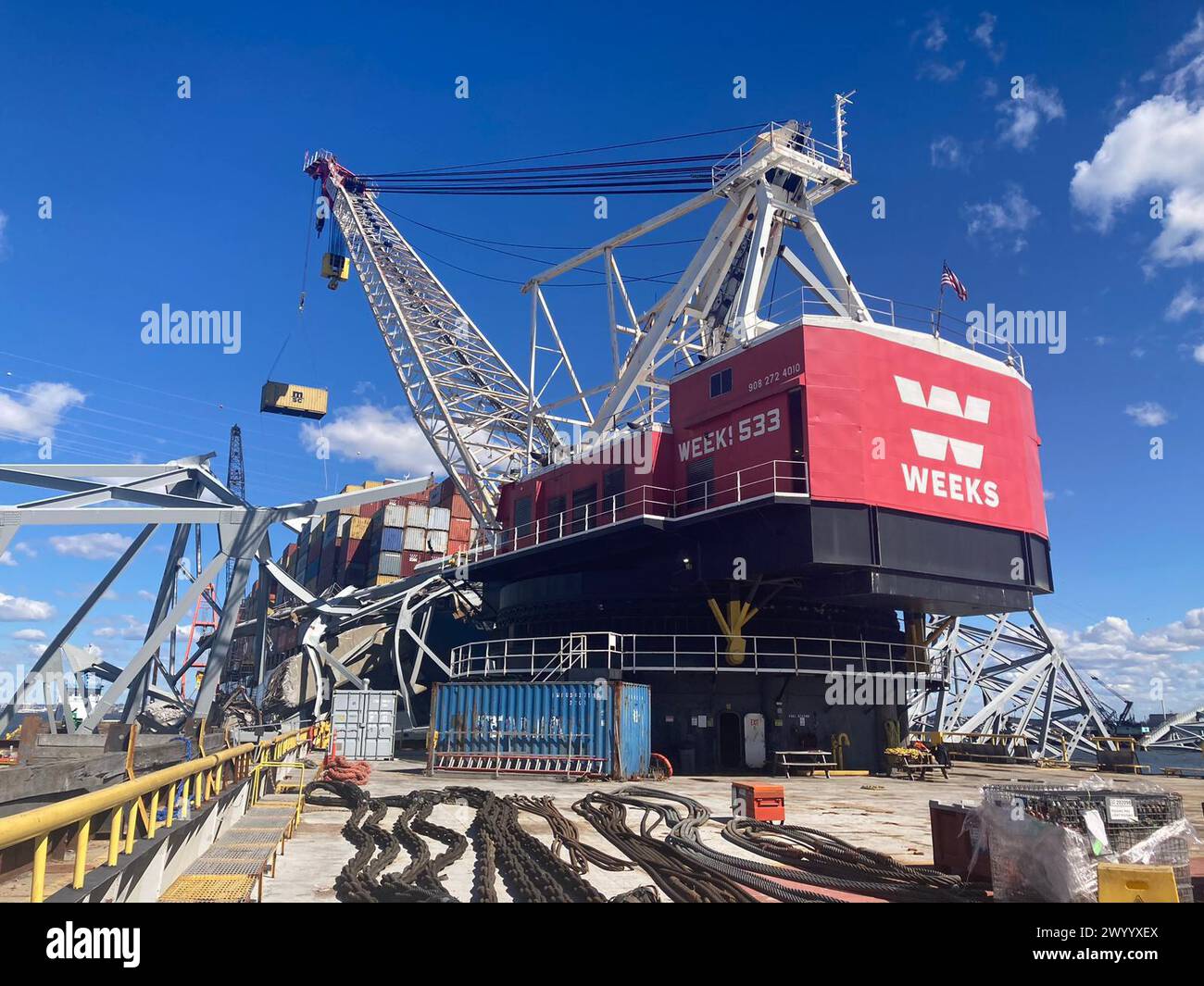 Response crews began removing shipping containers using a floating ...