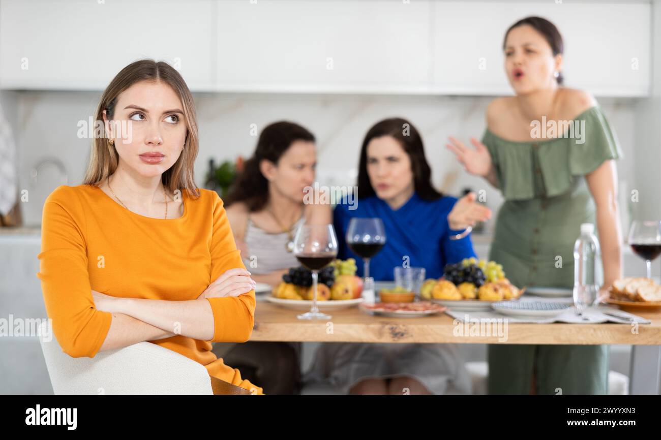 Female friends during family quarrel accuse girl Stock Photo - Alamy