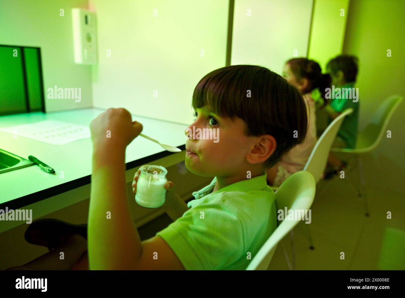 Children tutored by a sensory analysis specialist during a yoghurt ...