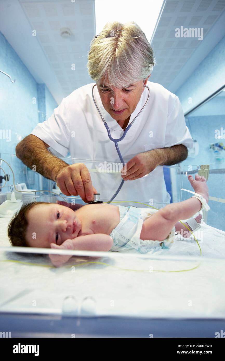 Pediatrician examining newborn baby, pediatrics. Hospital Policlinica ...