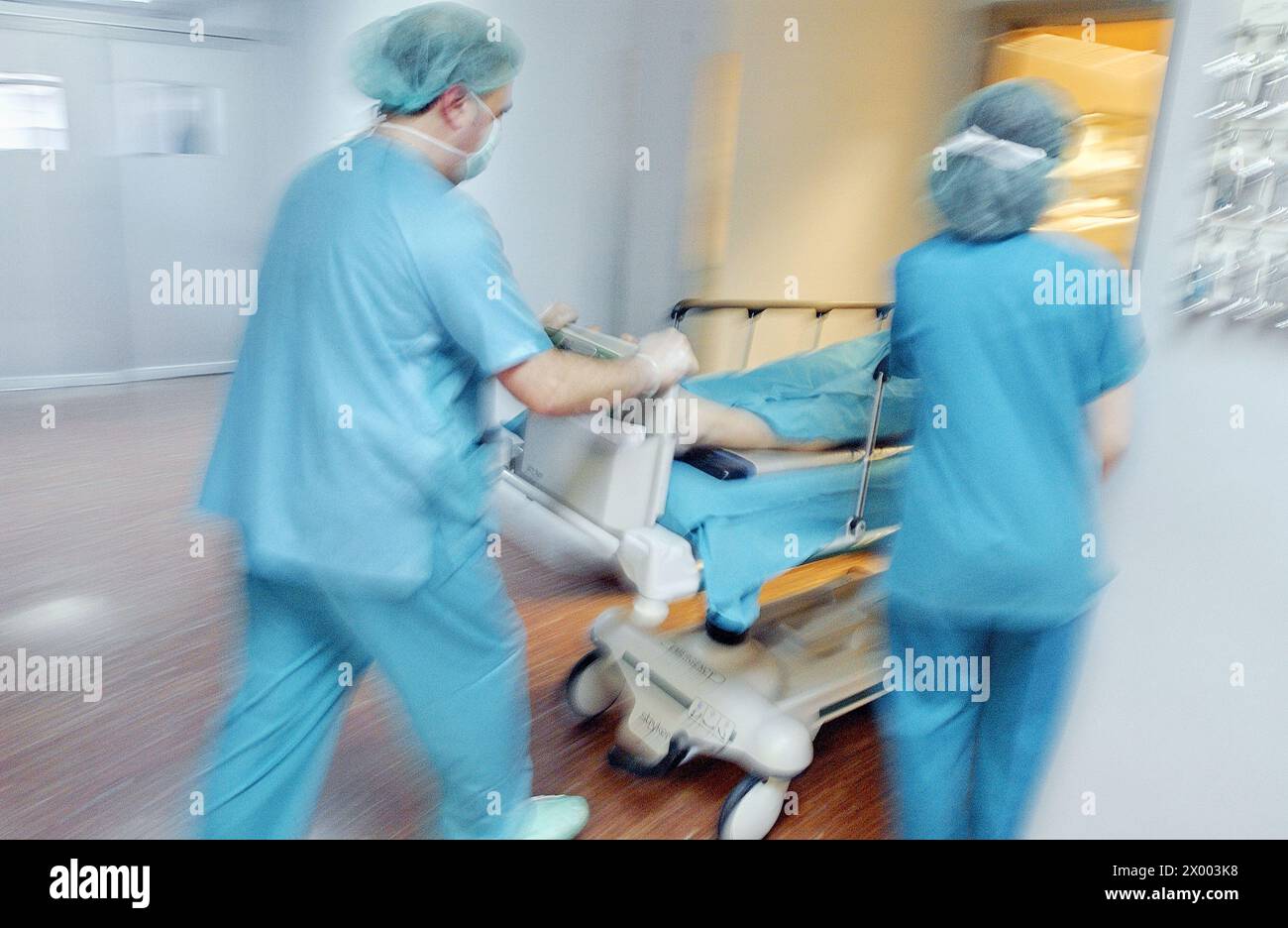 Carrying patient from operation room to resuscitation room, surgery ...
