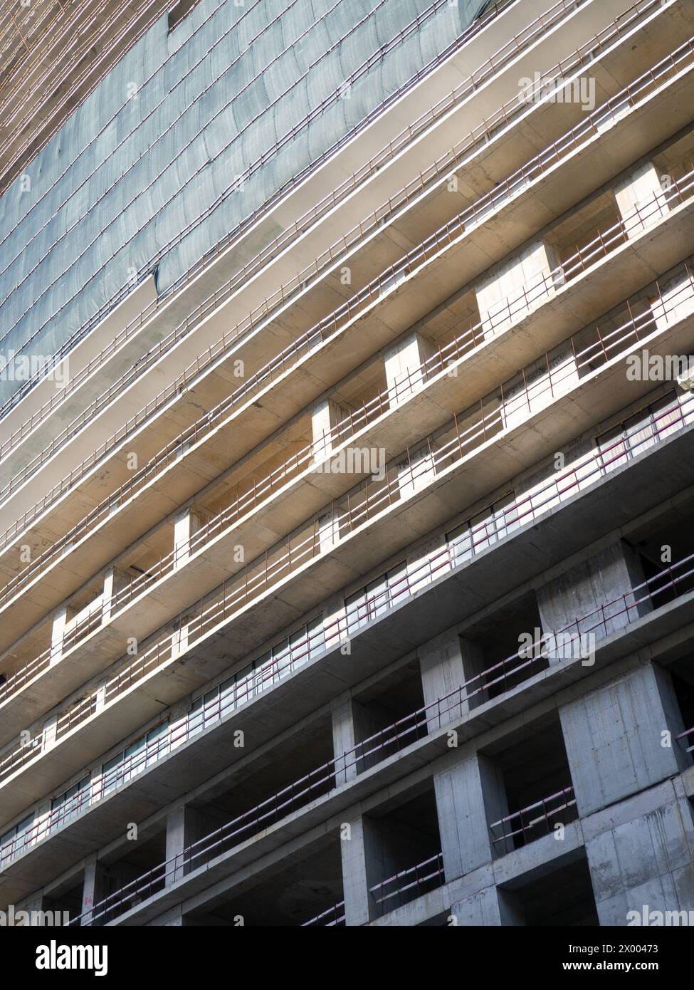 Concrete frame without facade. Unfinished construction of a multi-story ...