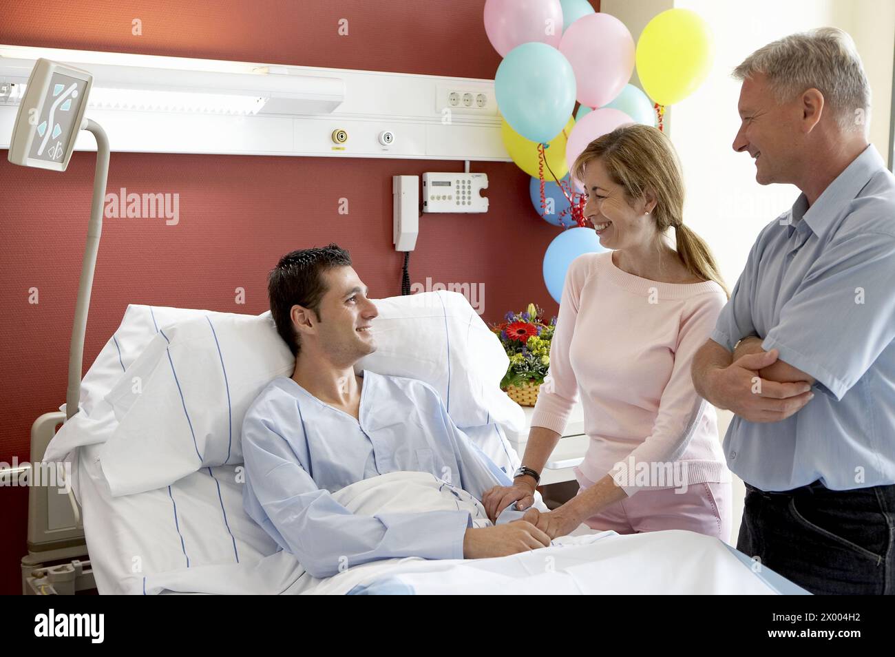 Male patient hospital bed relatives hi-res stock photography and images ...