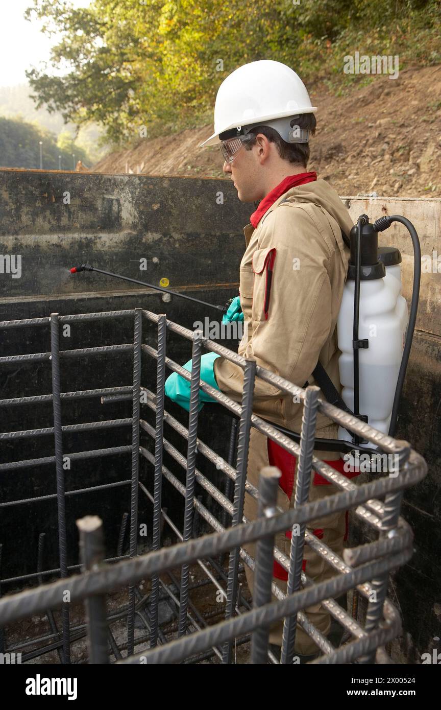 Applying form release agents with sprayer, concrete formworks Stock ...
