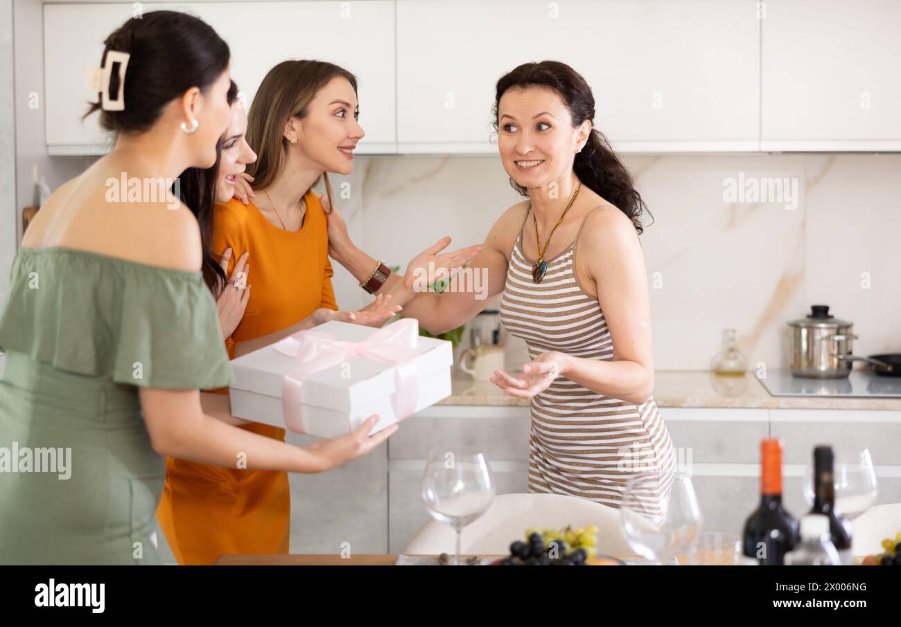 Joyful female friends greeting other hi-res stock photography and ...