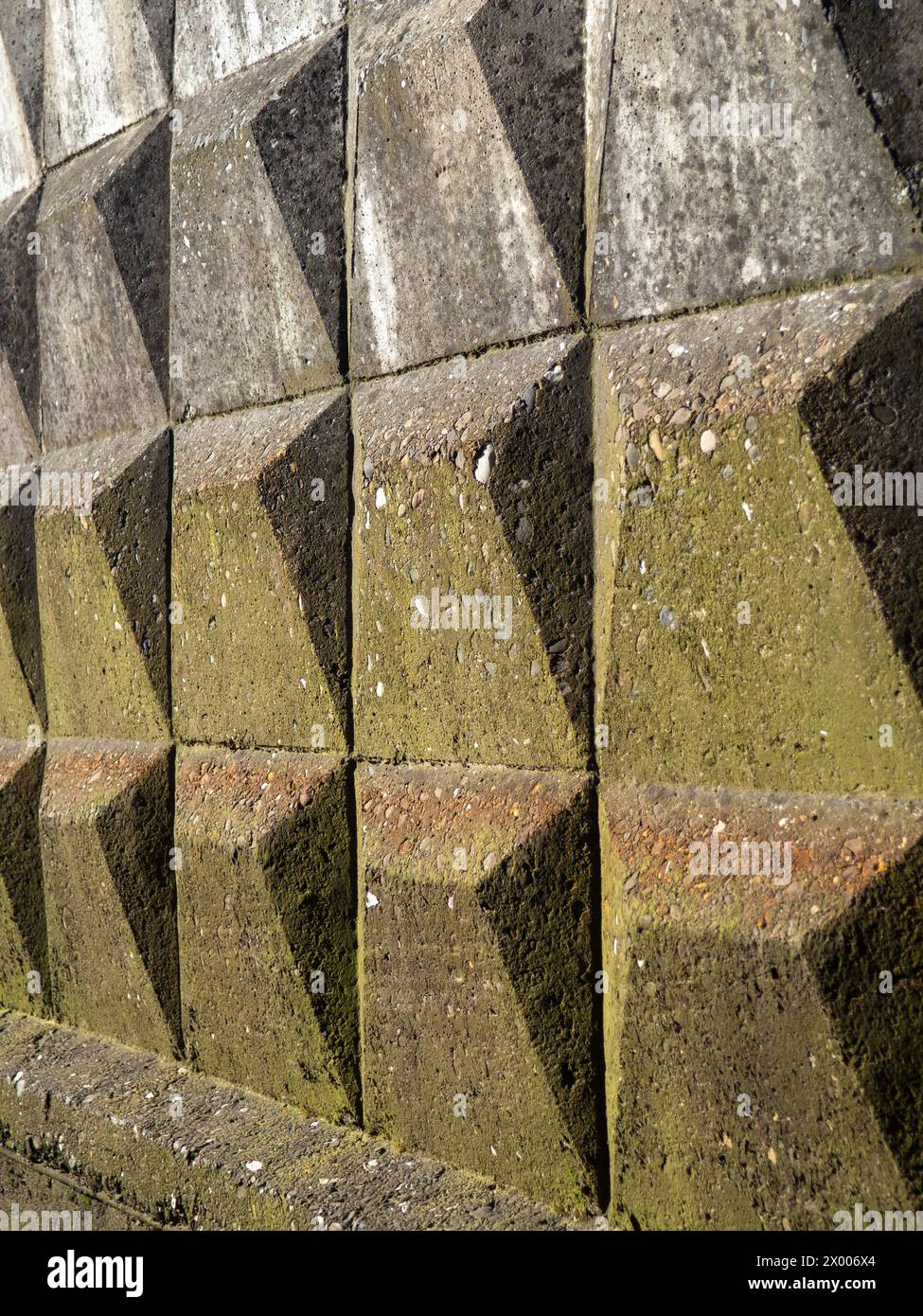 Old concrete fence. Greening concrete. Stone construction. Solid ...