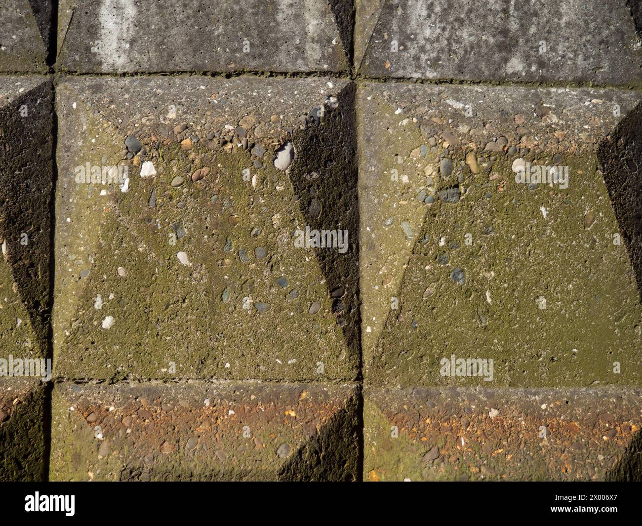 Old concrete fence. Greening concrete. Stone construction. Solid ...