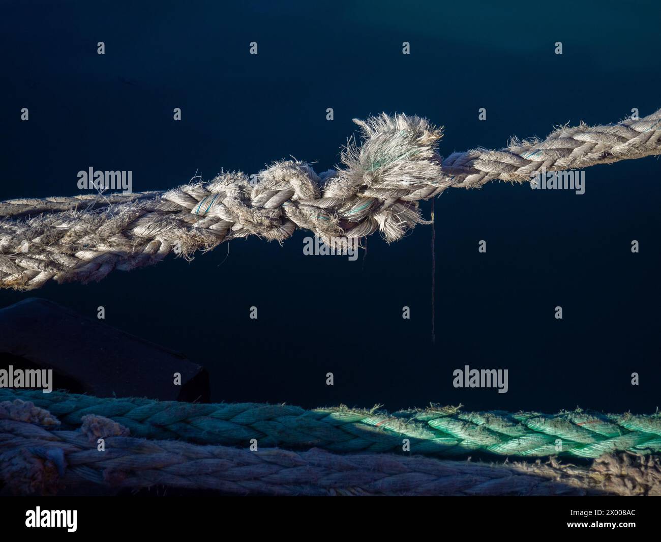 Knots on a tense mooring line. Fastening the ship to the shore. Tight ...