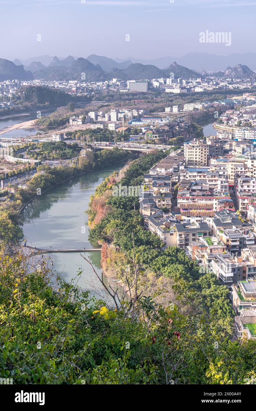 River bend surrounded by the city buildings and limestone rocks in ...