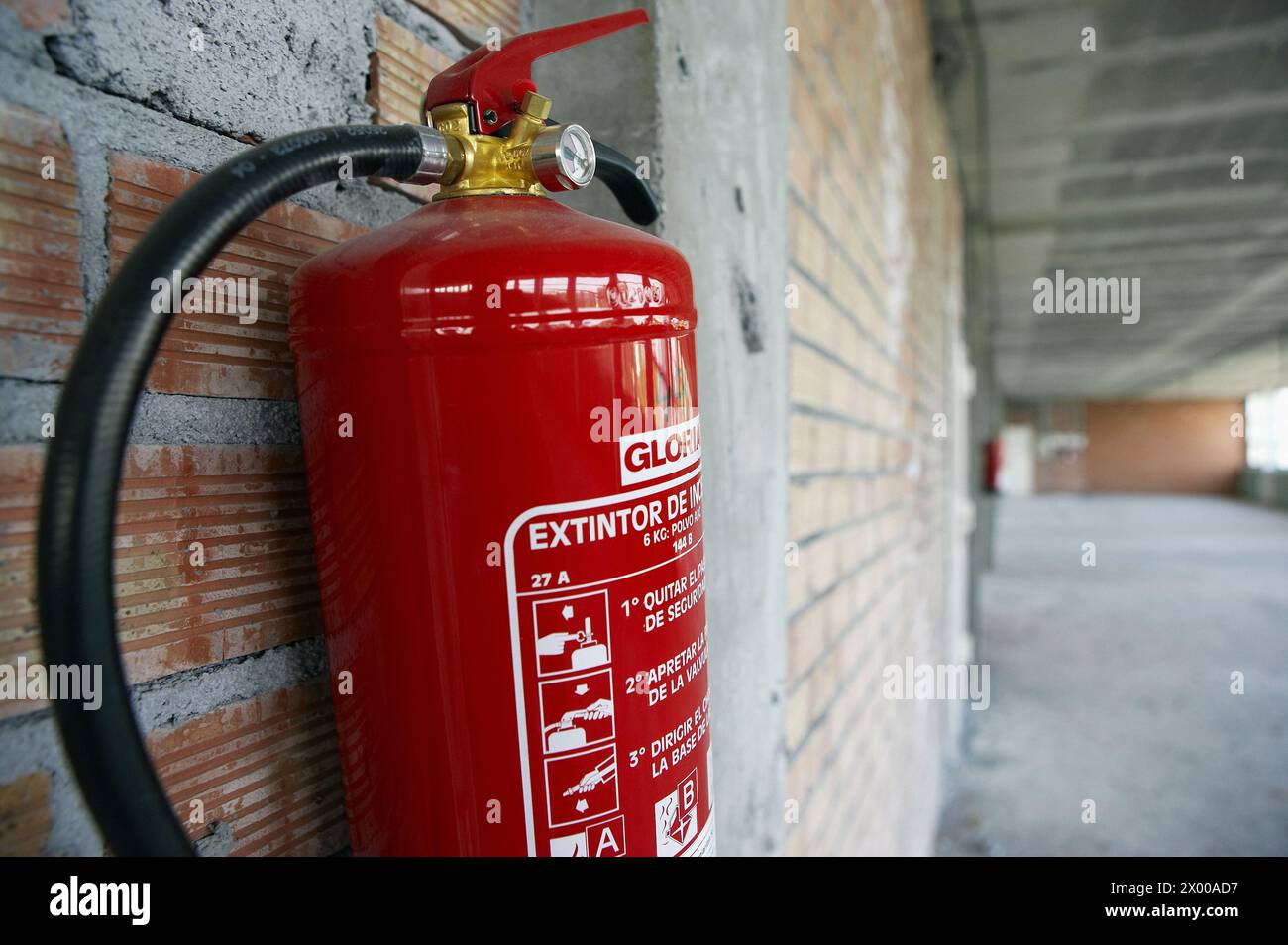 Fire extinguisher, office building under construction Stock Photo - Alamy
