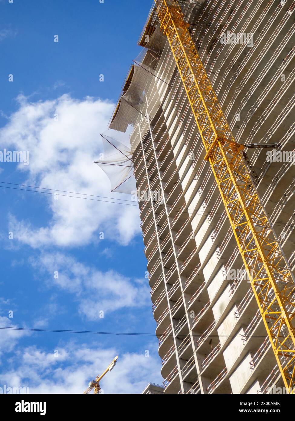 Construction of high-rise buildings in Asia. Concrete frame without facade. Development Stock ...