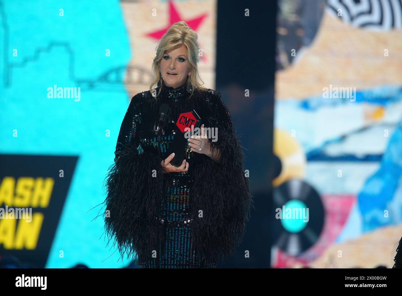 Trisha Yearwood accepts the June Carter Cash Humanitarian Award onstage ...