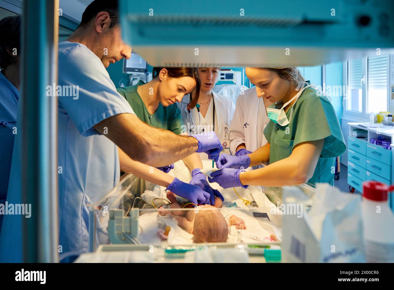 Team of doctors and nurses attending to a baby, Neonatal pediatrics ...