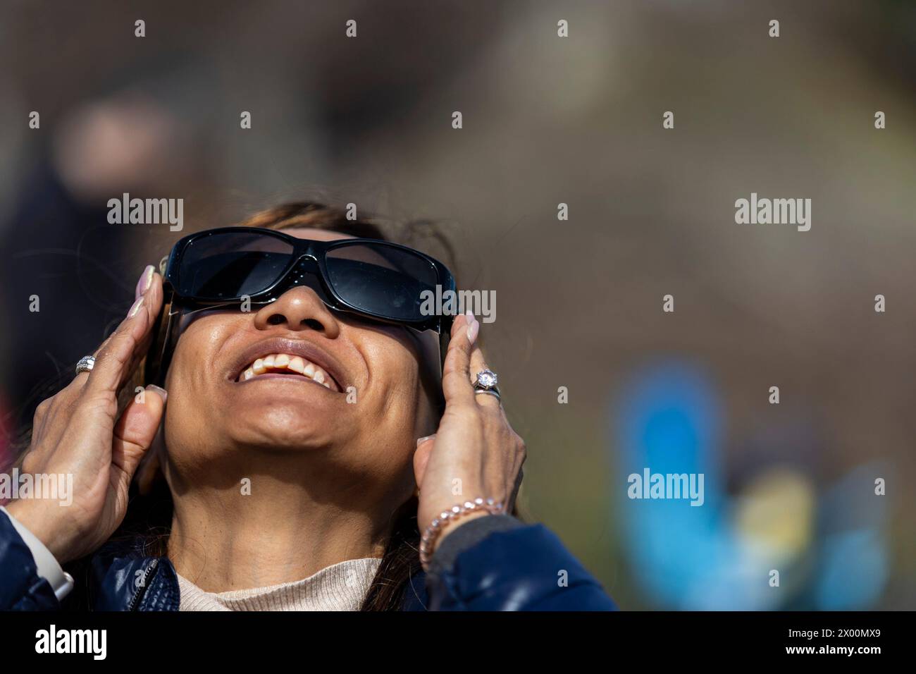 Plattsburgh, USA. 8th Apr, 2024. A woman watches a solar eclipse at ...