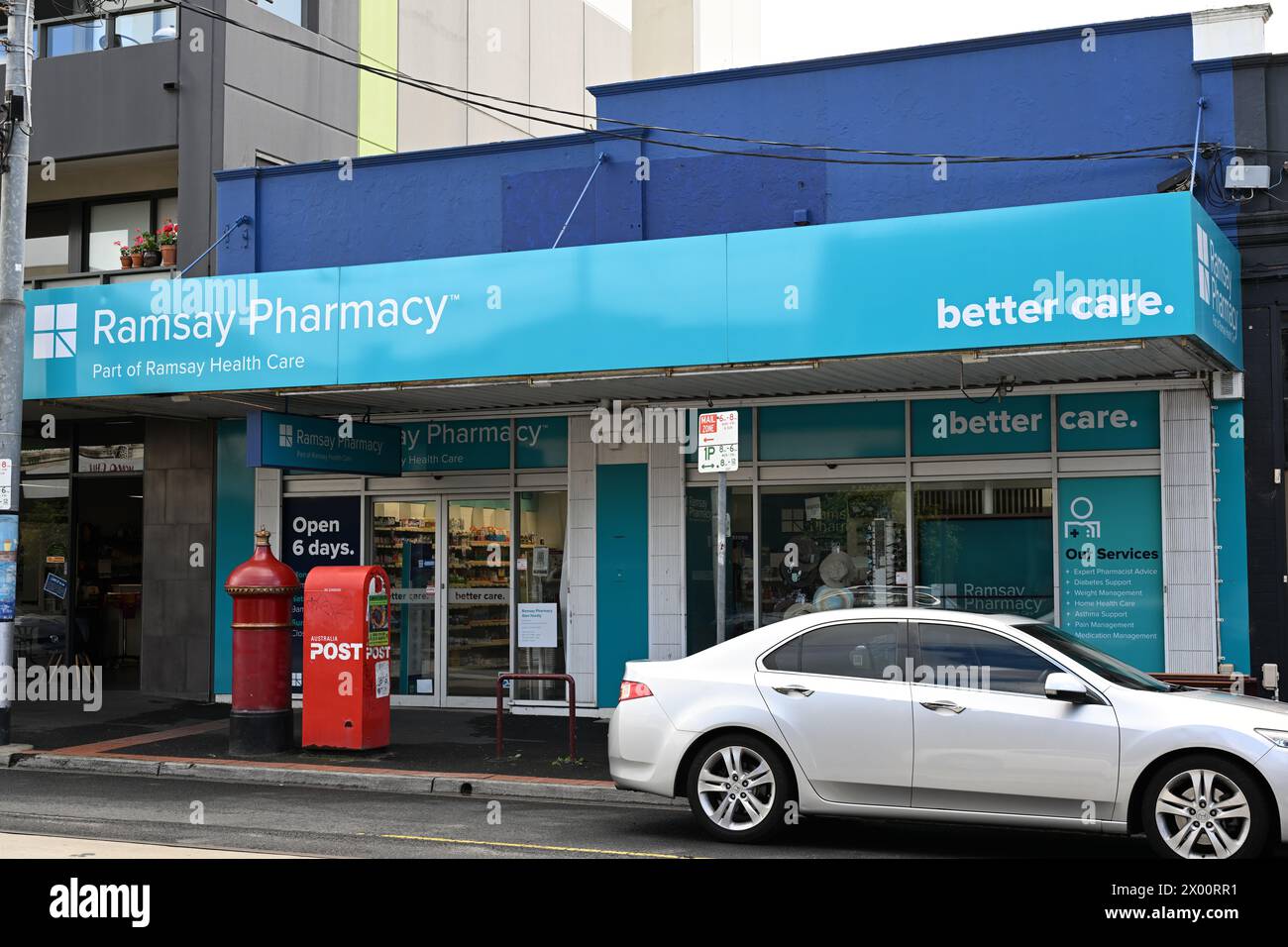 Exterior of blue Ramsay Pharmacy building, with Ramsay Health Care ...