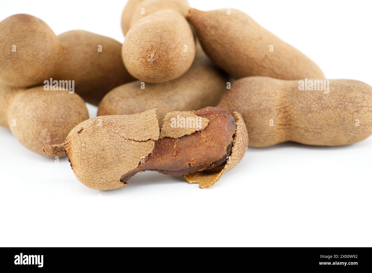 Tamarind fruits, whole and cracked open isolated on white background ...
