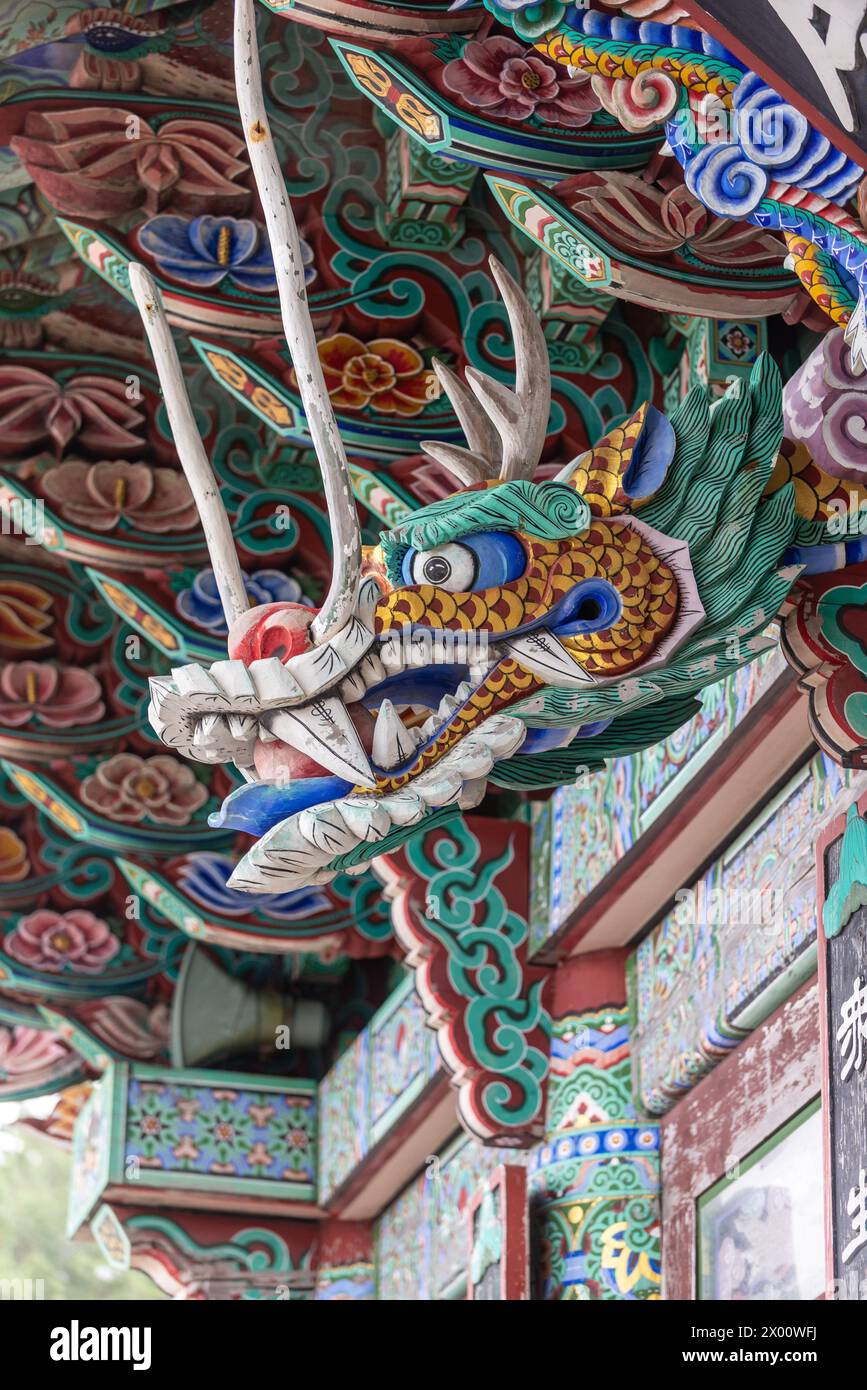 Closeup of wooden dragon carving with colorful Dancheong painting ...