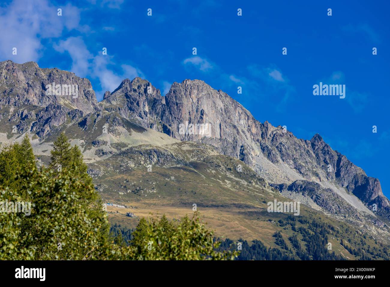 Sunny weather in the Alps mountains with some clouds. Tour du Montblanc ...