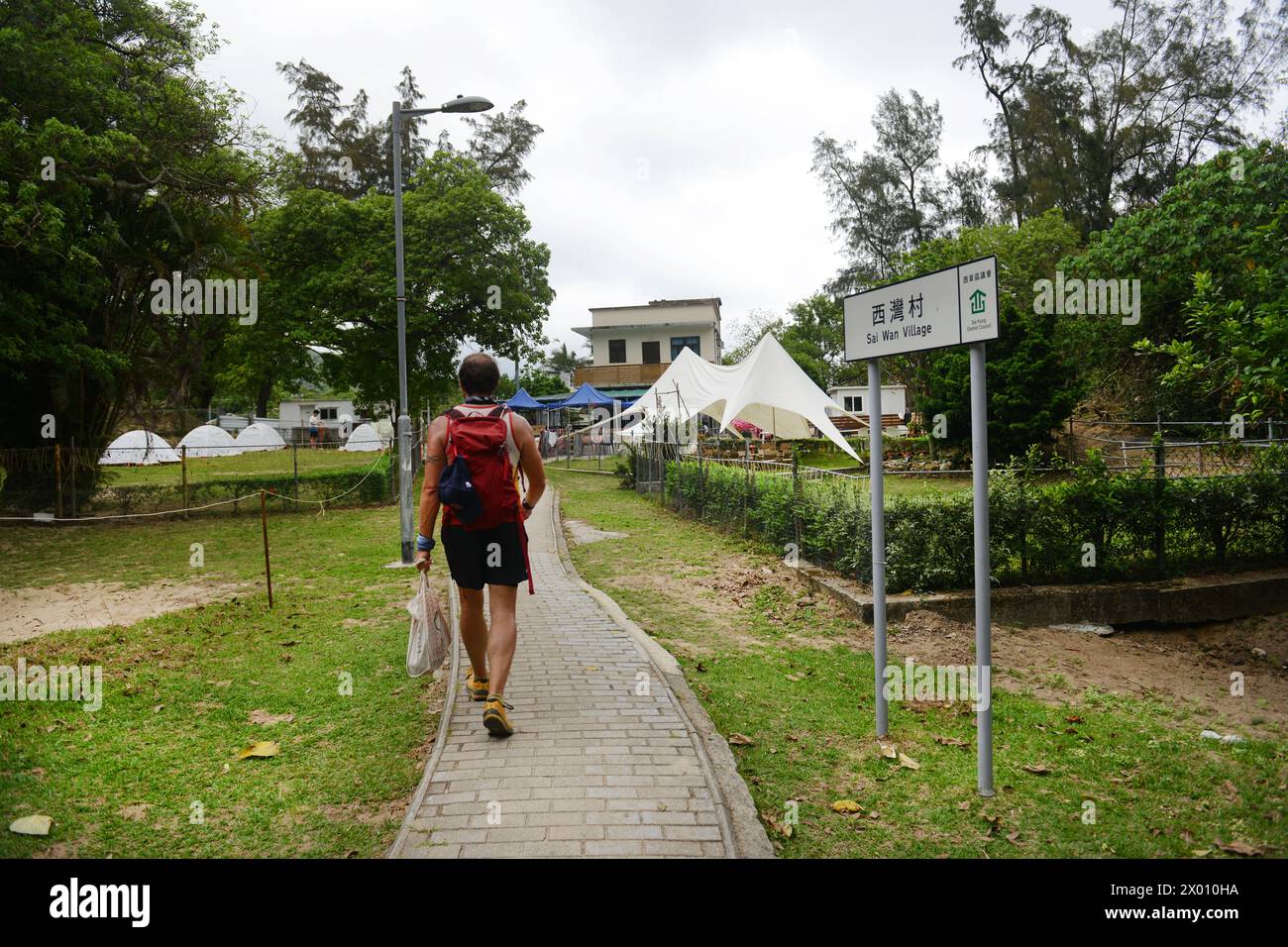 A hiker reaching Sai Wan village in the Sai Kung Country Park in Hong ...