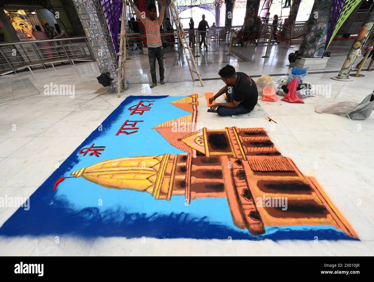 NEW DELHI, INDIA - APRIL 8: Workers making Shri Ram Mandir rangoli ...