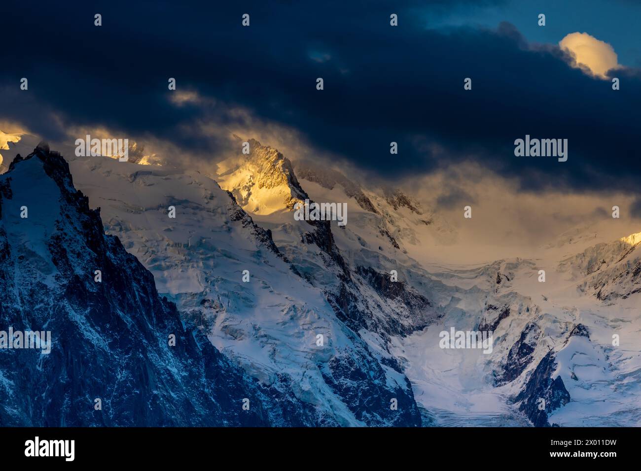 Nasty weather in the Alps mountains with lots of dark clouds before the ...