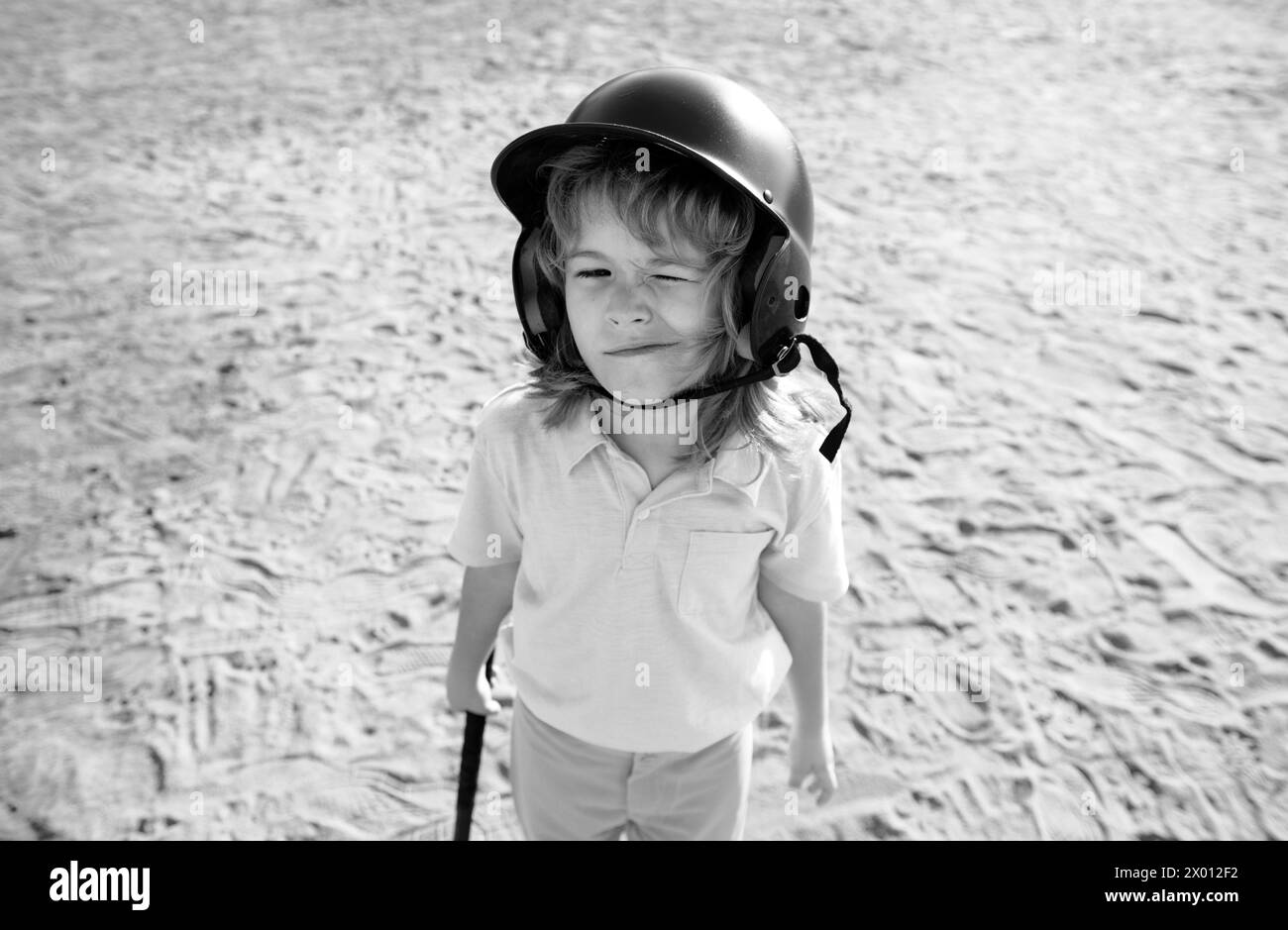 Funny child playing Baseball, winking. Batter in youth league getting a ...