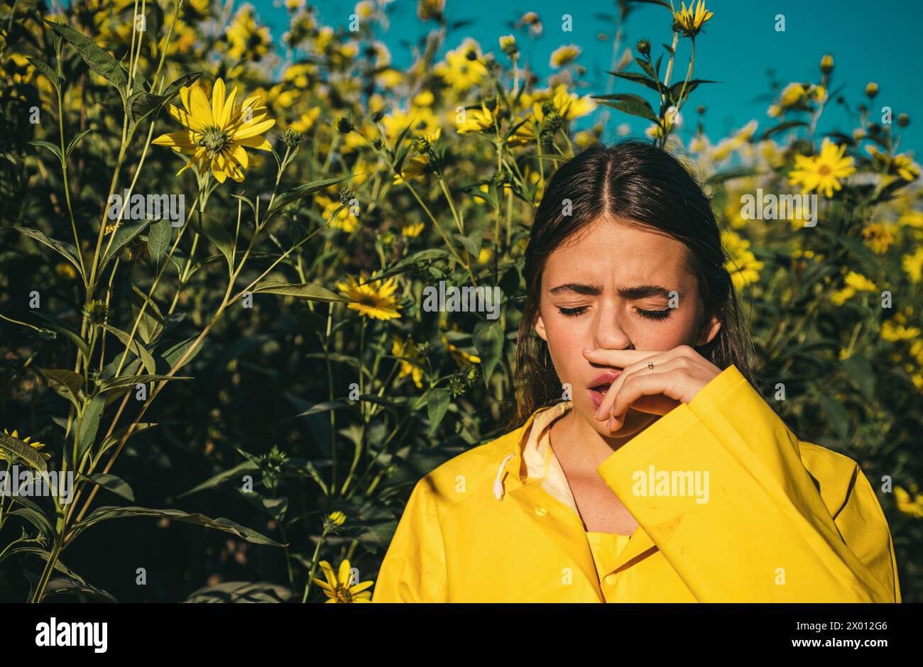 The girl suffers from pollen allergy during flowering and uses napkins ...