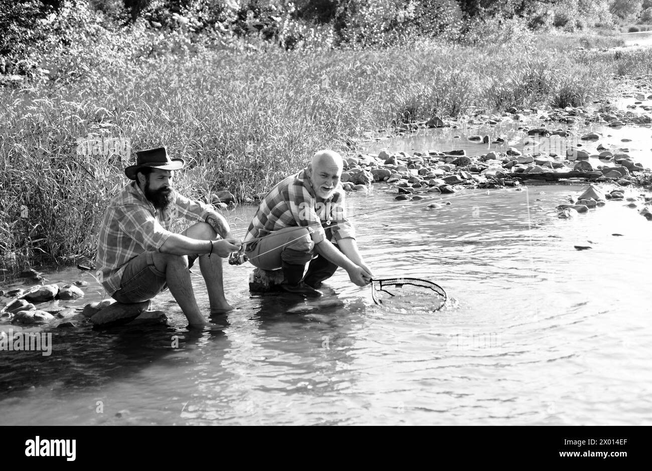 Fisherman men friends and trophy trout. Father and son fishing ...