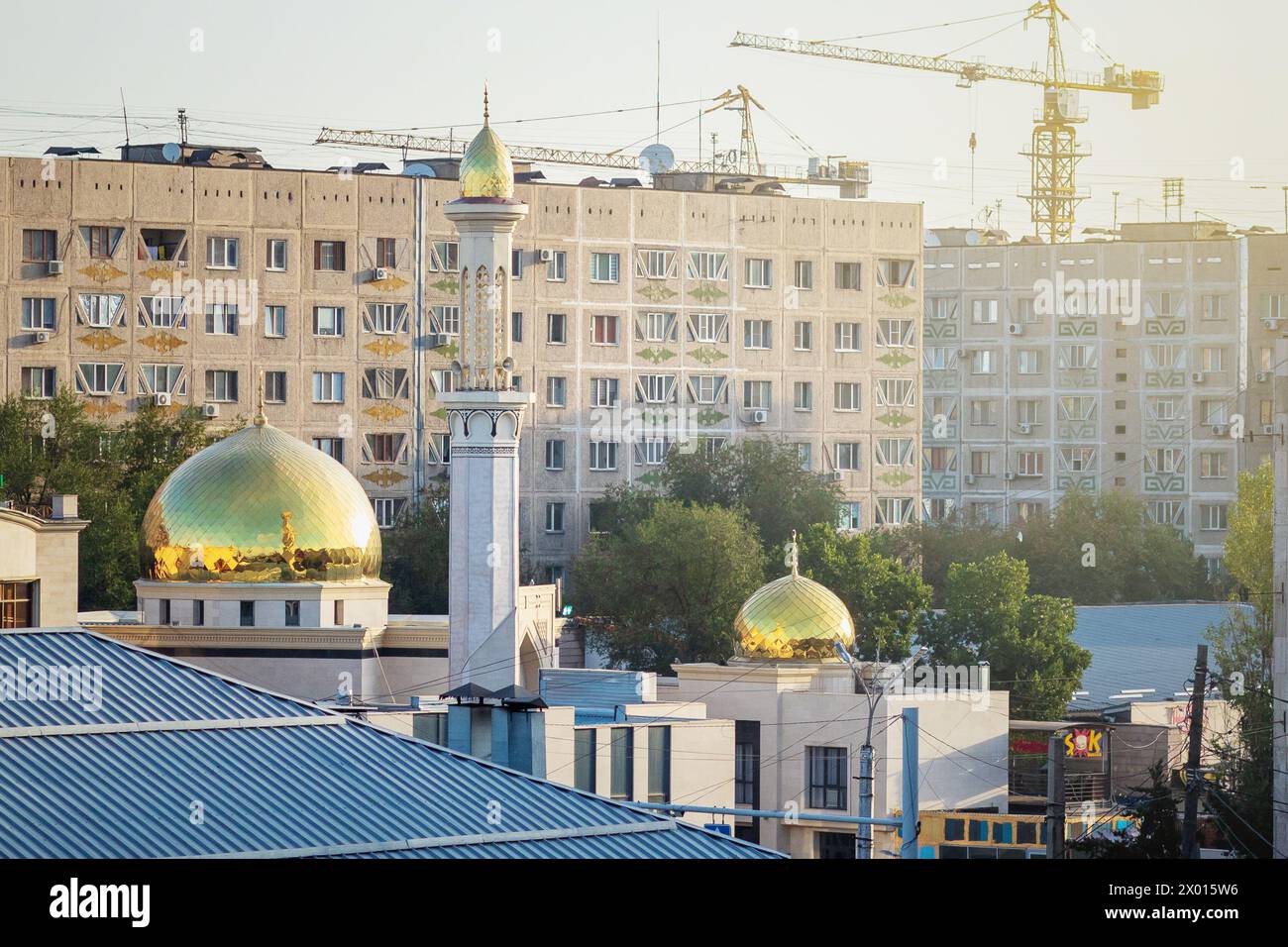A mosque in an urban area among dense buildings of residential high ...