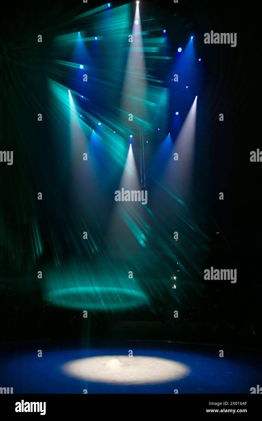 Vertical background of multi-colored lighting from stage spotlights ...