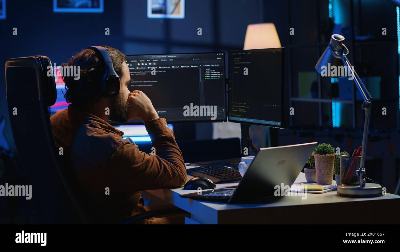Frenzied programmer suffering from adhd illness, impatiently taping desk with fingers while ...