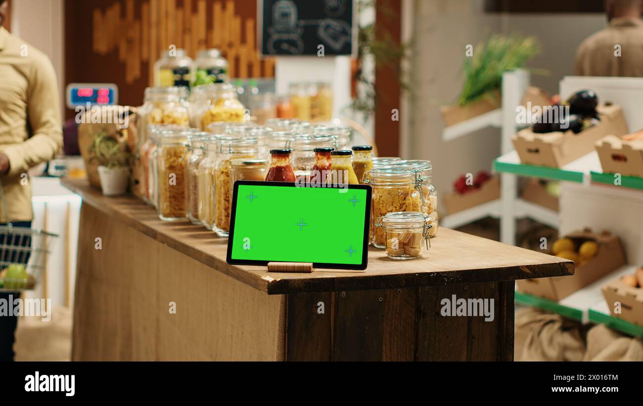 Greenscreen display shown on tablet at neighborhood grocery store ...