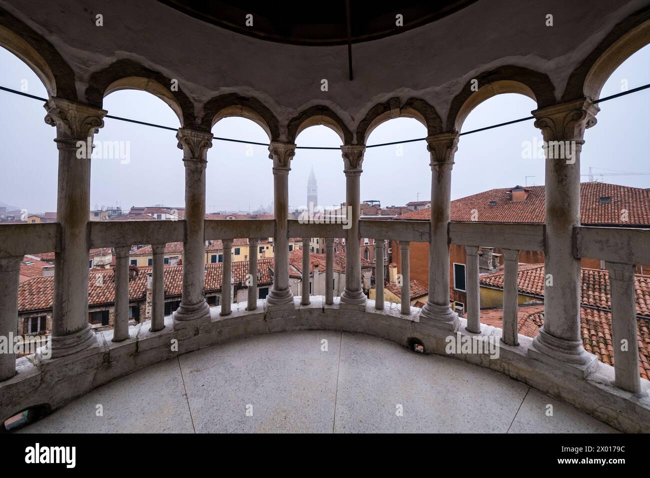 View over the roofs of Venice to the Campanile di San Marco, shrouded ...