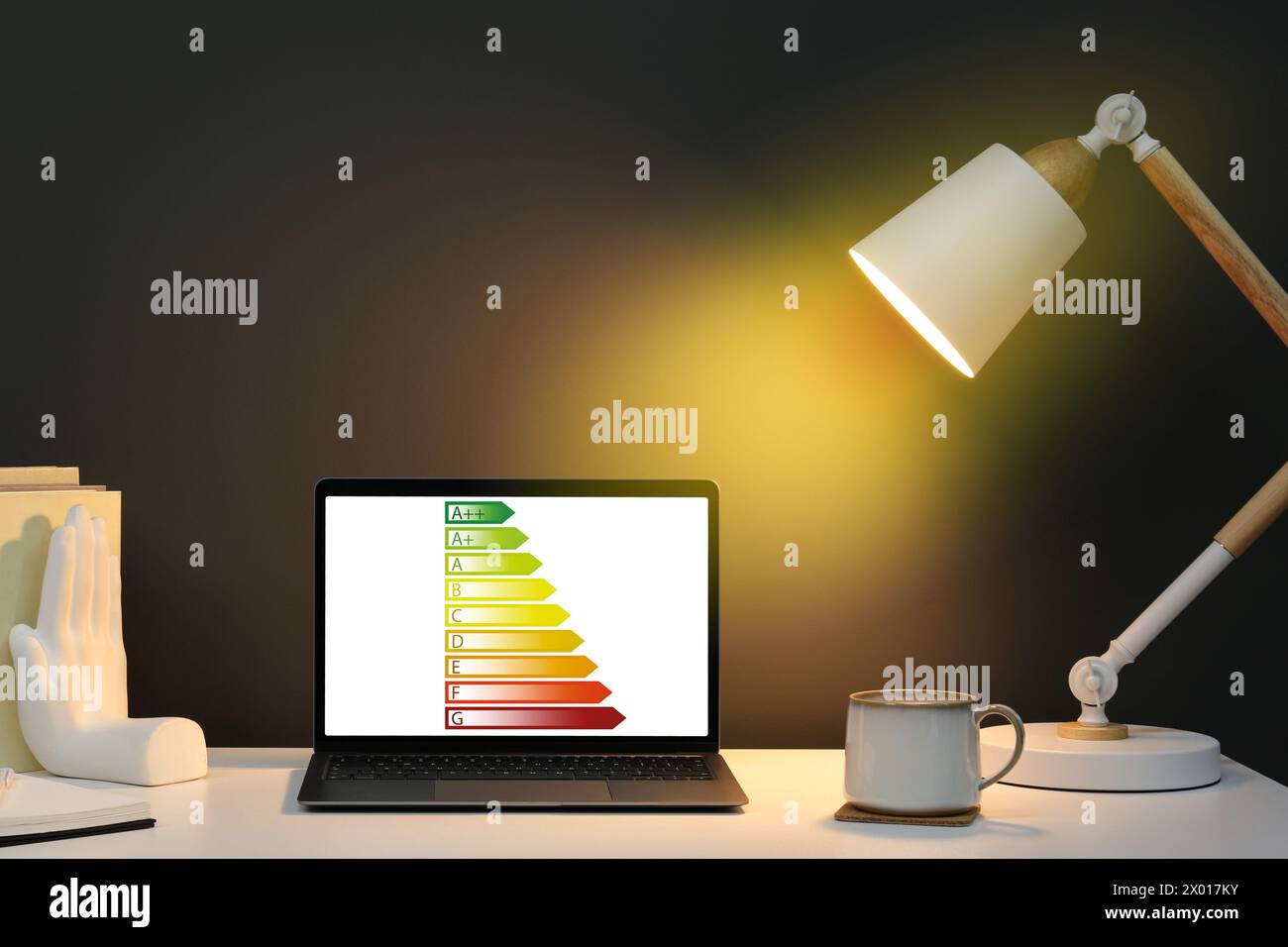Energy efficiency rating on laptop display. Workplace with modern ...