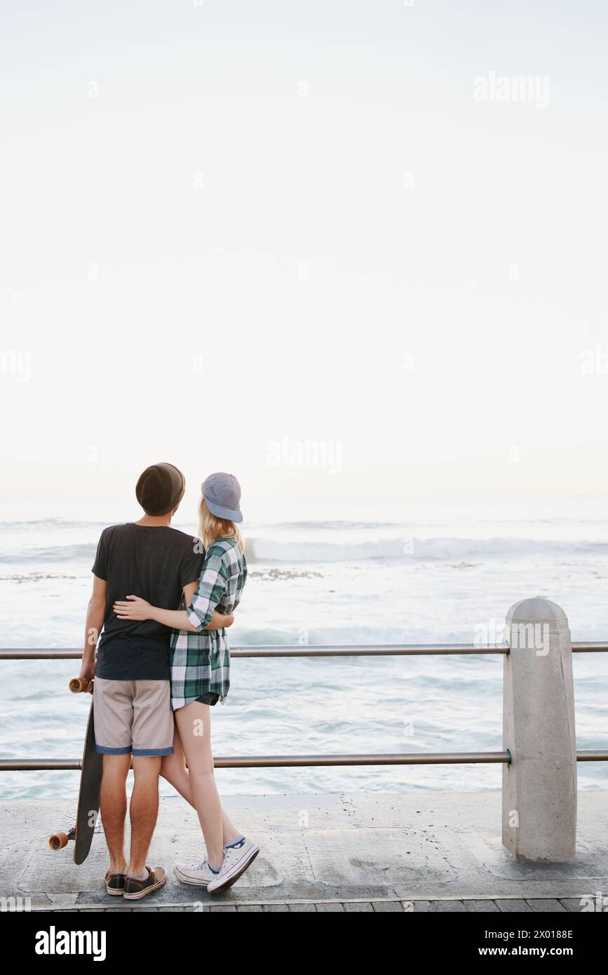 Couple, rear view and hug on beach for travel with mockup space ...
