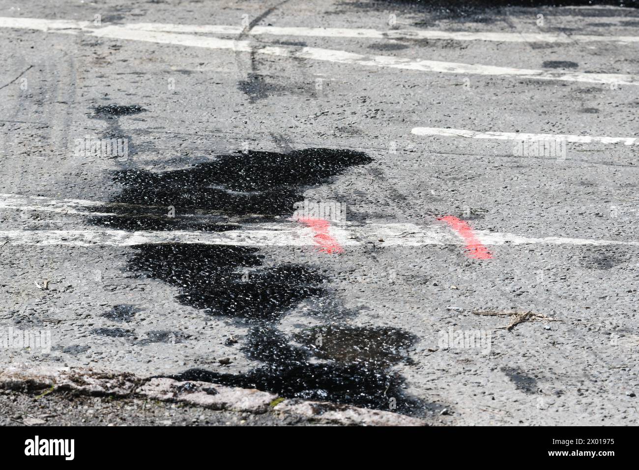 oil spill on a road after a accident Stock Photo - Alamy