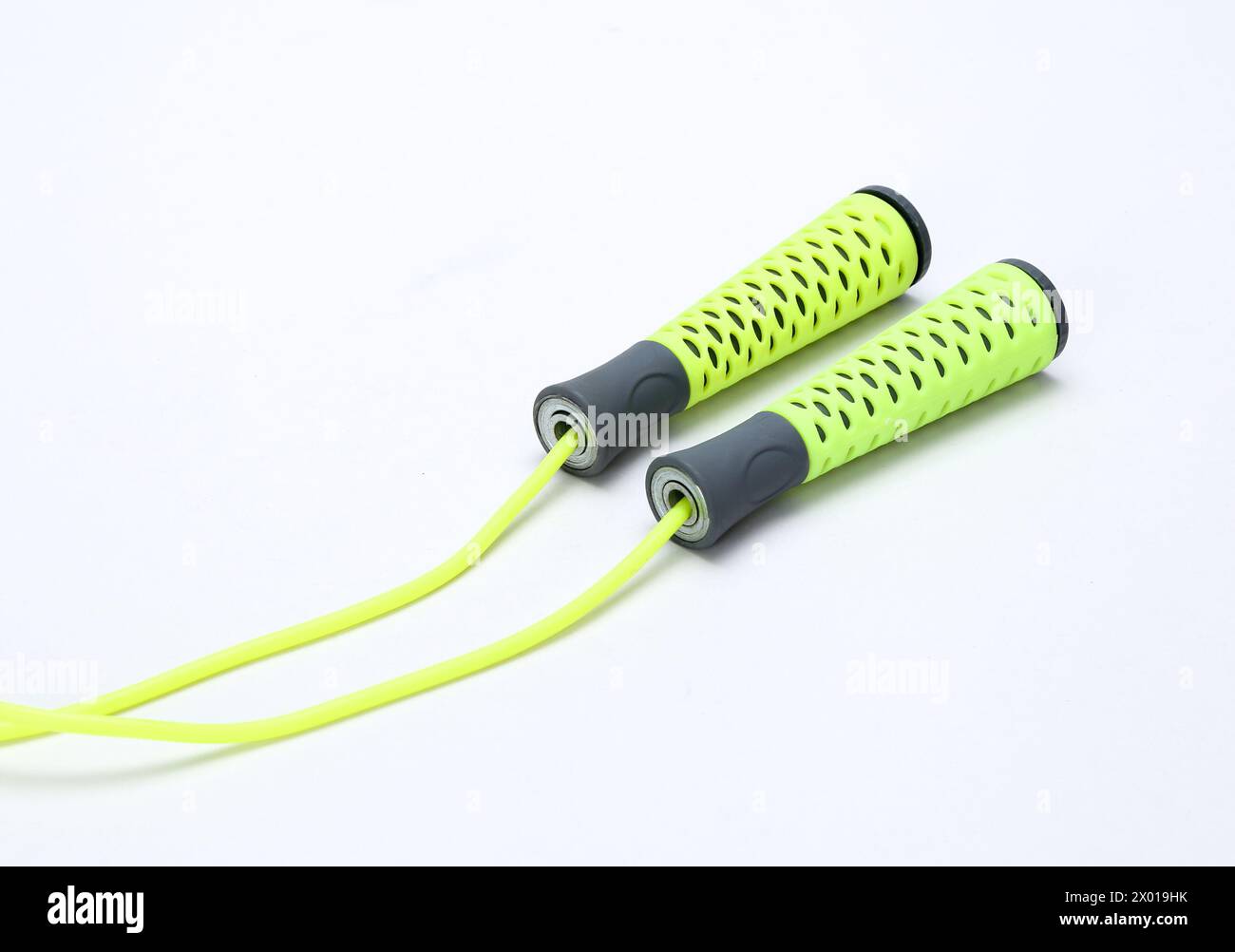 Green skipping rope for an exercise, isolated on white Stock Photo - Alamy