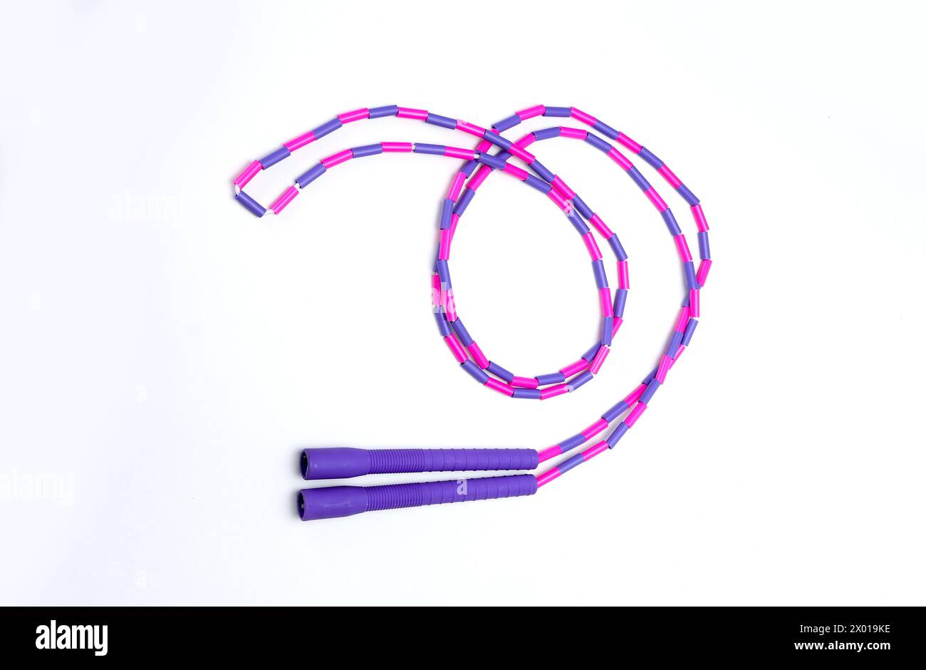 purple and pink skipping rope isolated on white background Stock Photo ...