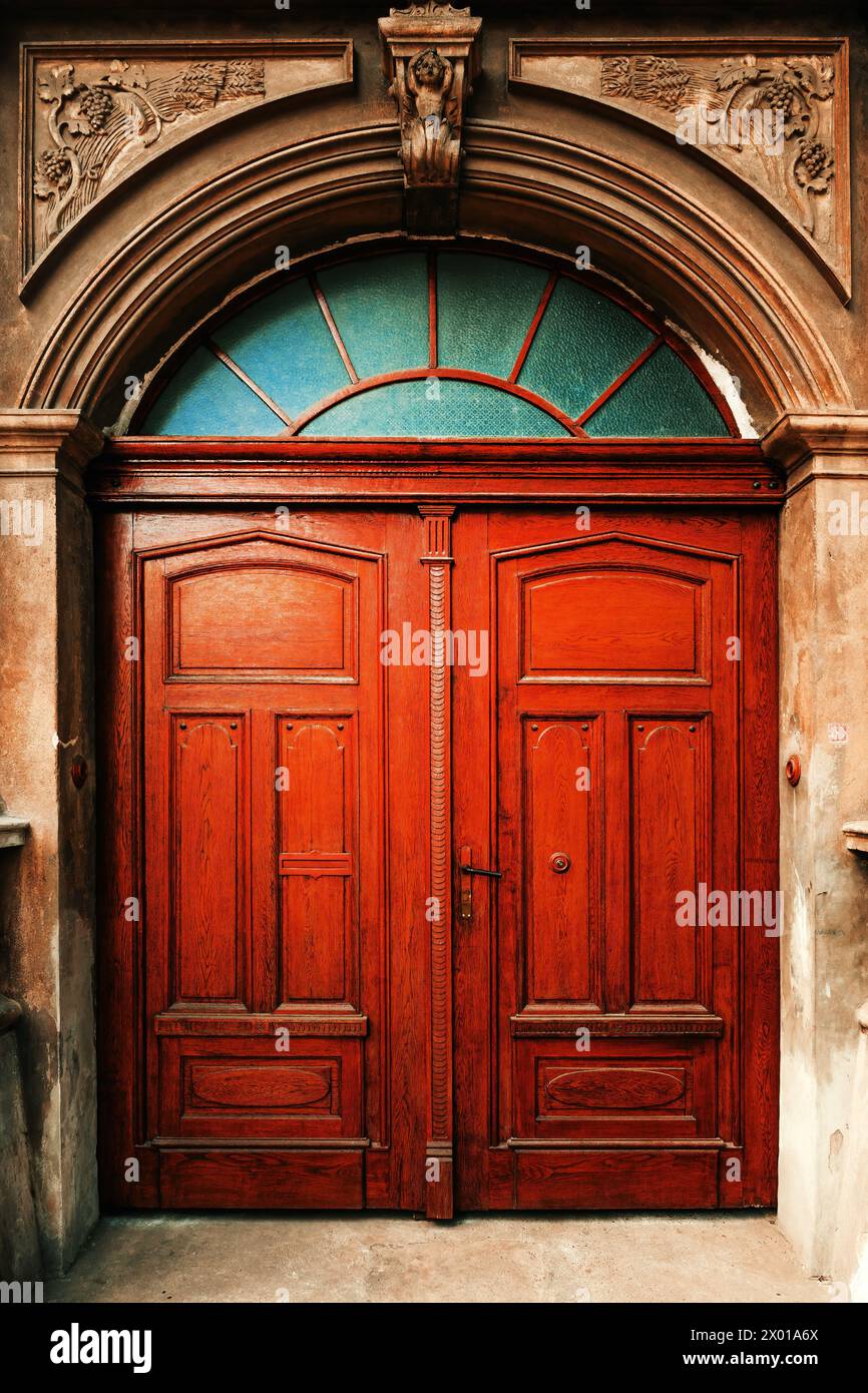 Massive vintage wooden door as an entrance to an old residential ...
