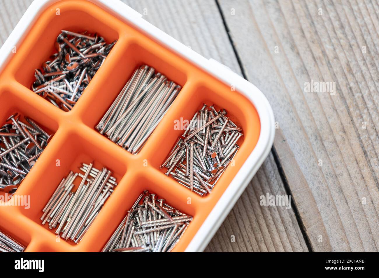 Collection of nails, thumb nails, screws, plastic and bolts in plastic ...