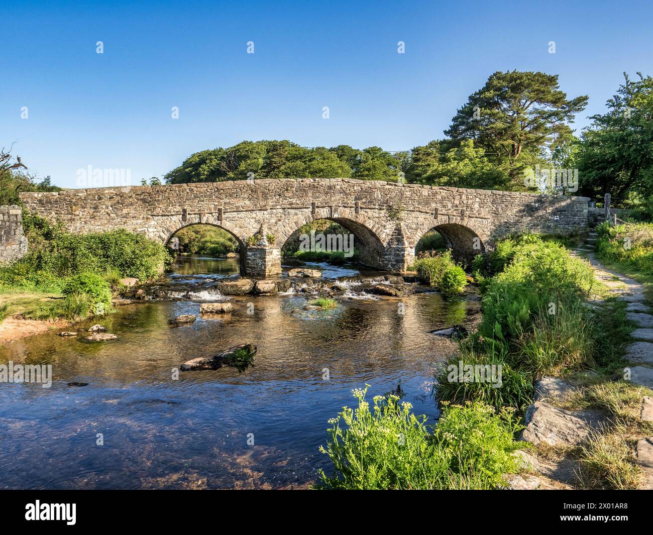 The old road bridge over the East Dart River at Postbridge, on Dartmoor ...