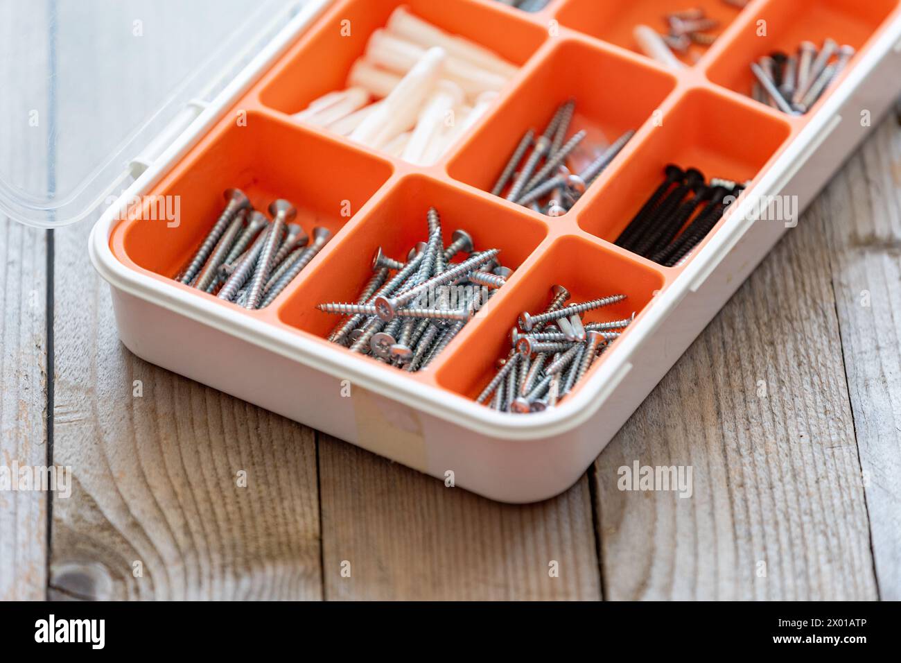 Collection of nails, thumb nails, screws, plastic and bolts in plastic ...